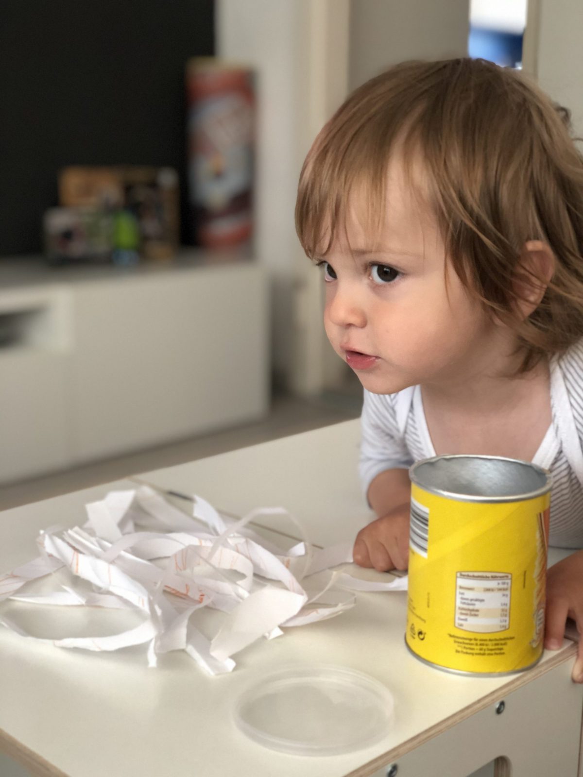 Shredded paper play – Happy Mommy Pose