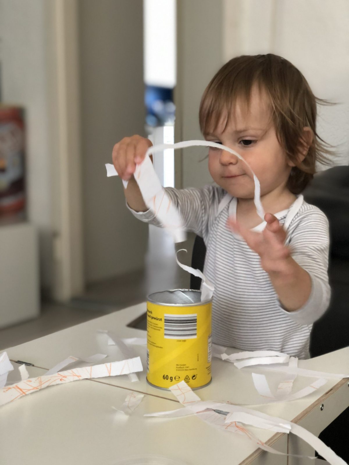 Shredded paper play – Happy Mommy Pose