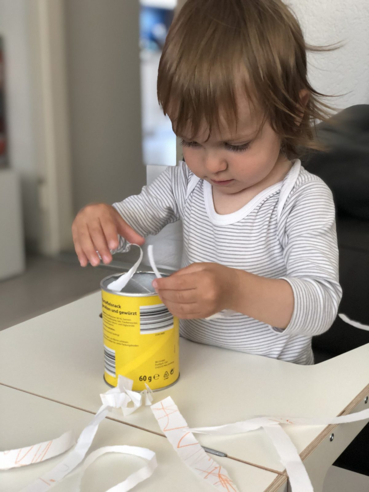 Shredded paper play – Happy Mommy Pose